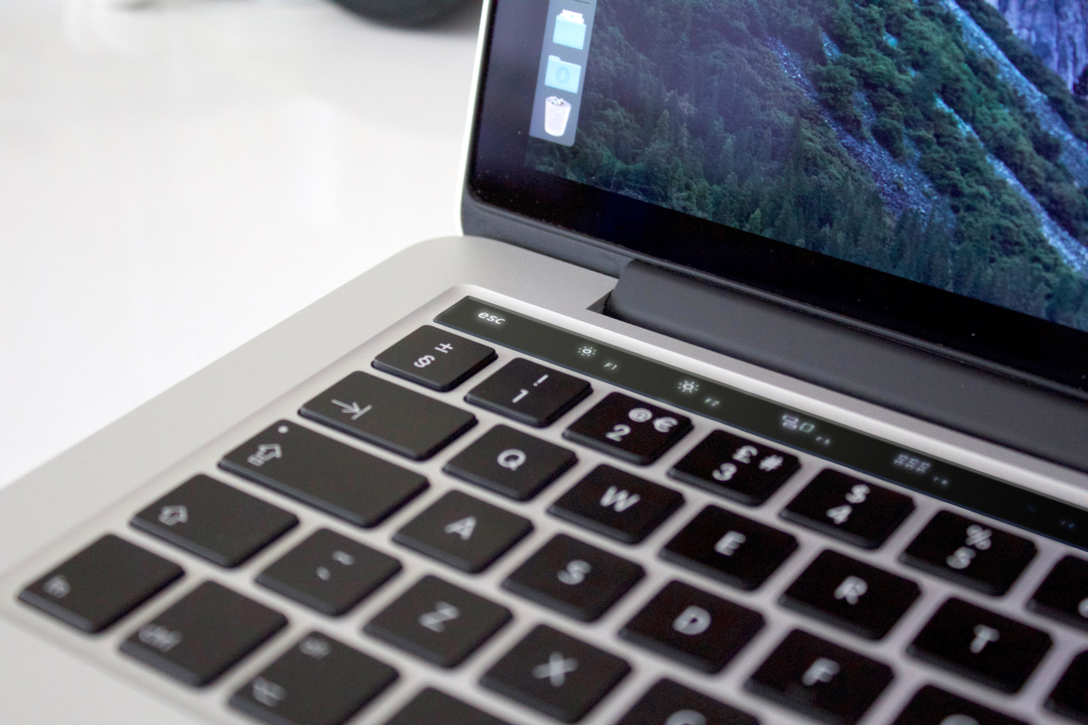 Why the MacBook Pro needs an OLED touch pad