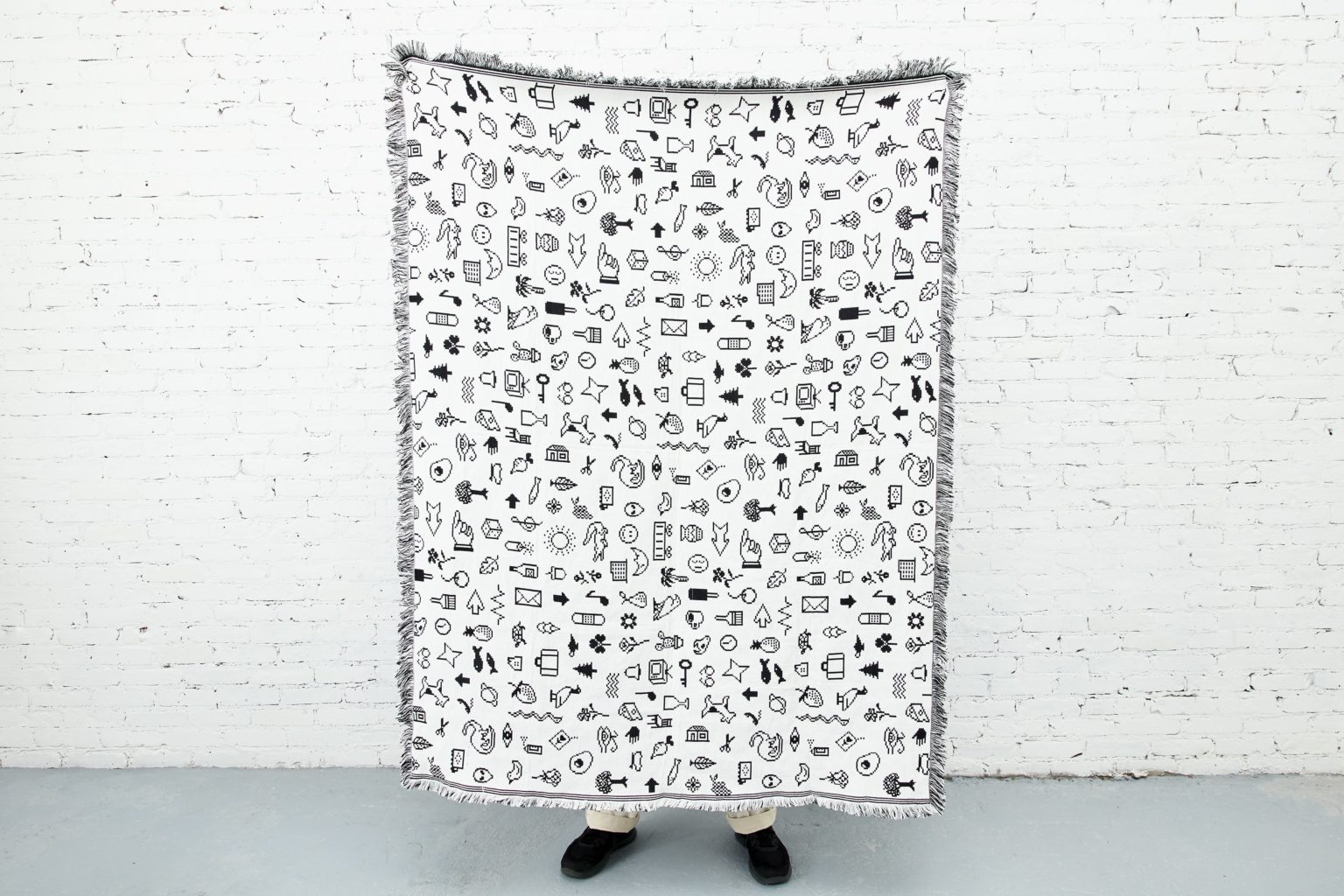 Designer of iconic dingbats Cairo font recreates it as throw | Cult of Mac