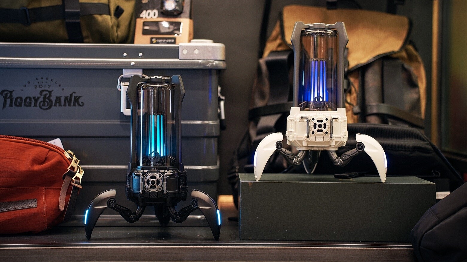 These tiny robots are actually a charger and a Bluetooth speaker